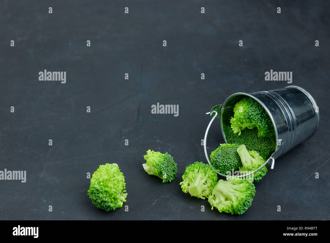 placer green broccoli segments from a small bucket. Healthy eating ...