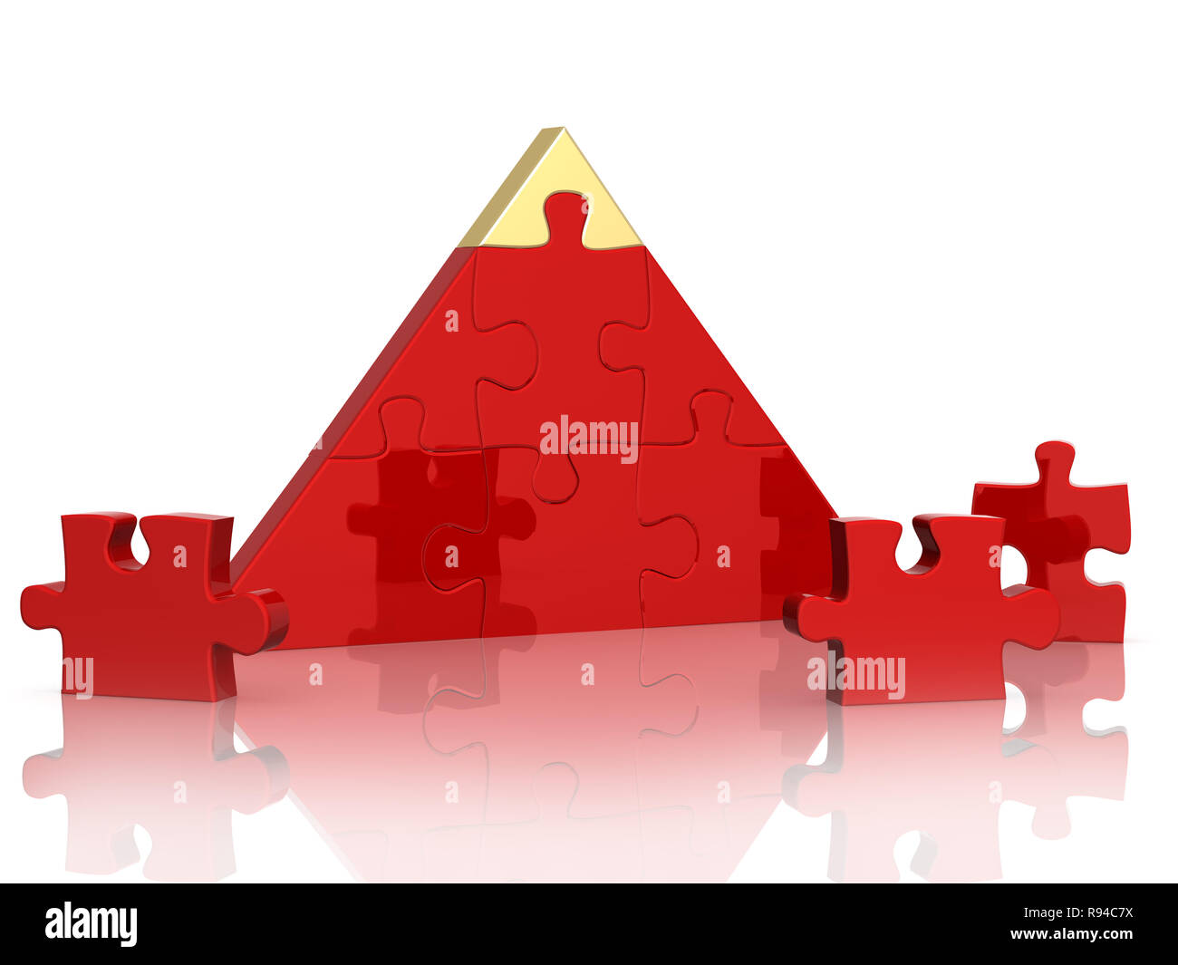 Pyramid from parts of a puzzle with gold top Stock Photo - Alamy