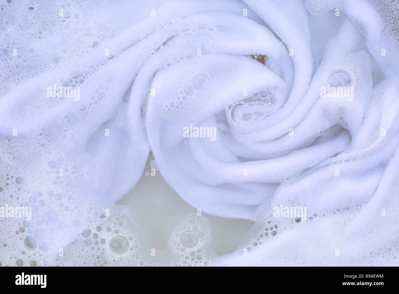 Soak a cloth before washing, white cloth Stock Photo - Alamy