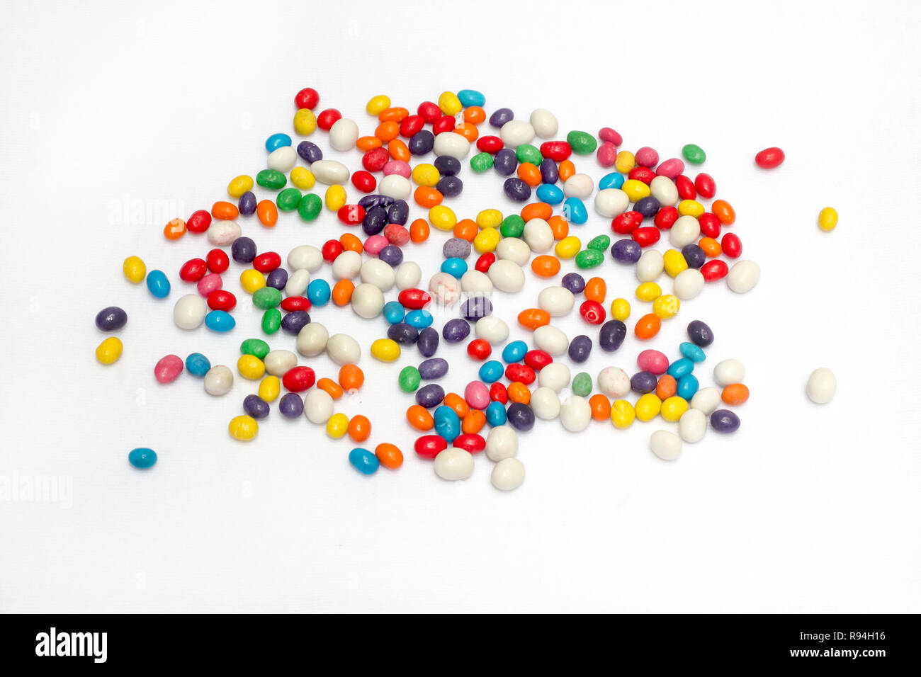 colorful candy scattered isolated with white background Stock Photo - Alamy