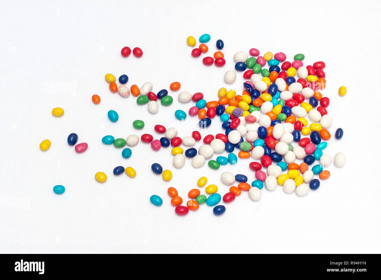 colorful candy scattered isolated with white background Stock Photo - Alamy