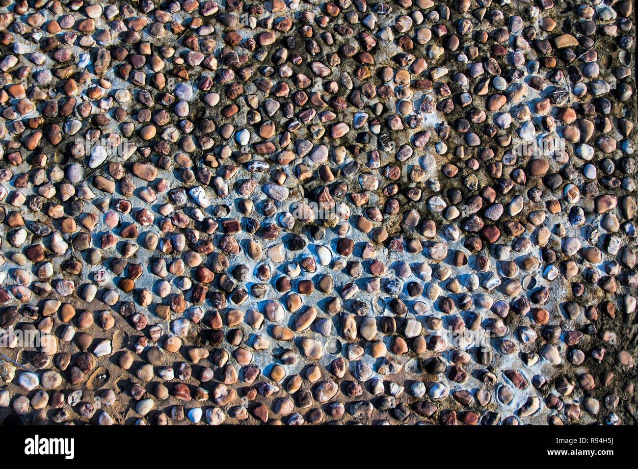 collection of small stones in the picture above Stock Photo - Alamy