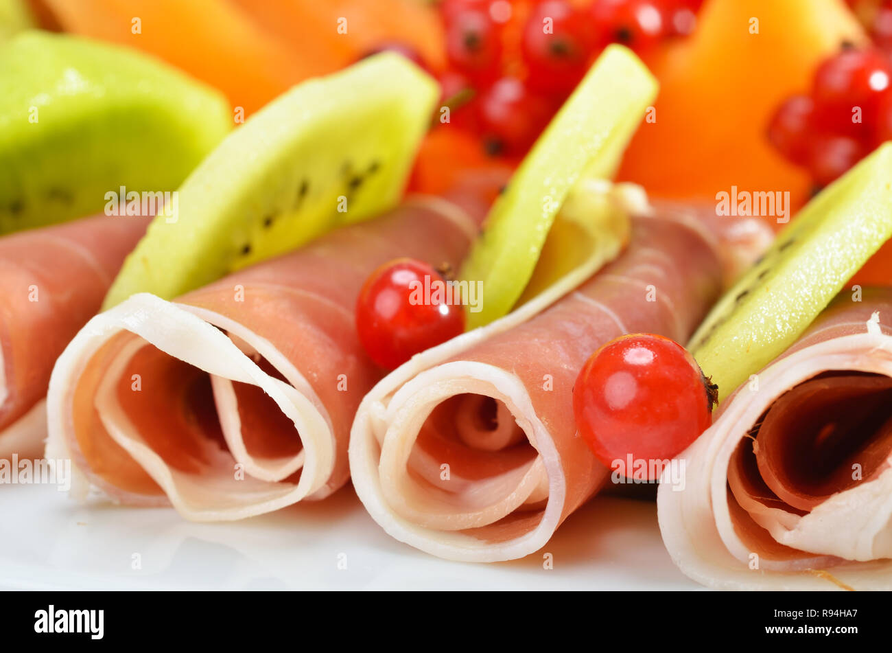Fine Italian ham with fresh fruits Stock Photo - Alamy