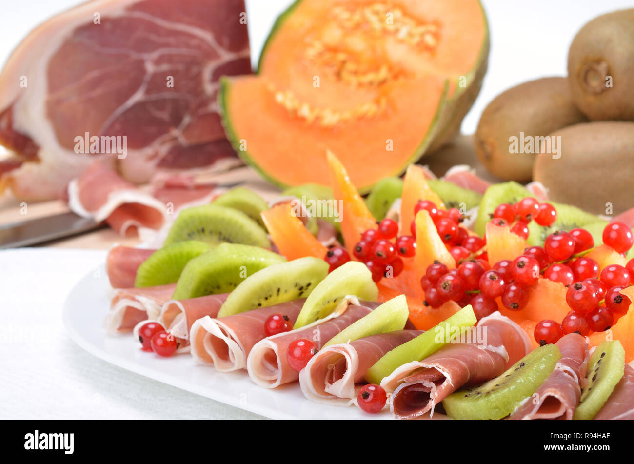 Fine Italian ham with fresh fruits Stock Photo - Alamy