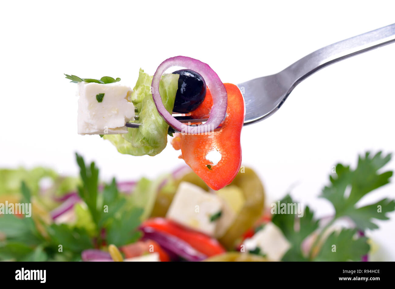 Delicious greek country style salad on a fork Stock Photo - Alamy