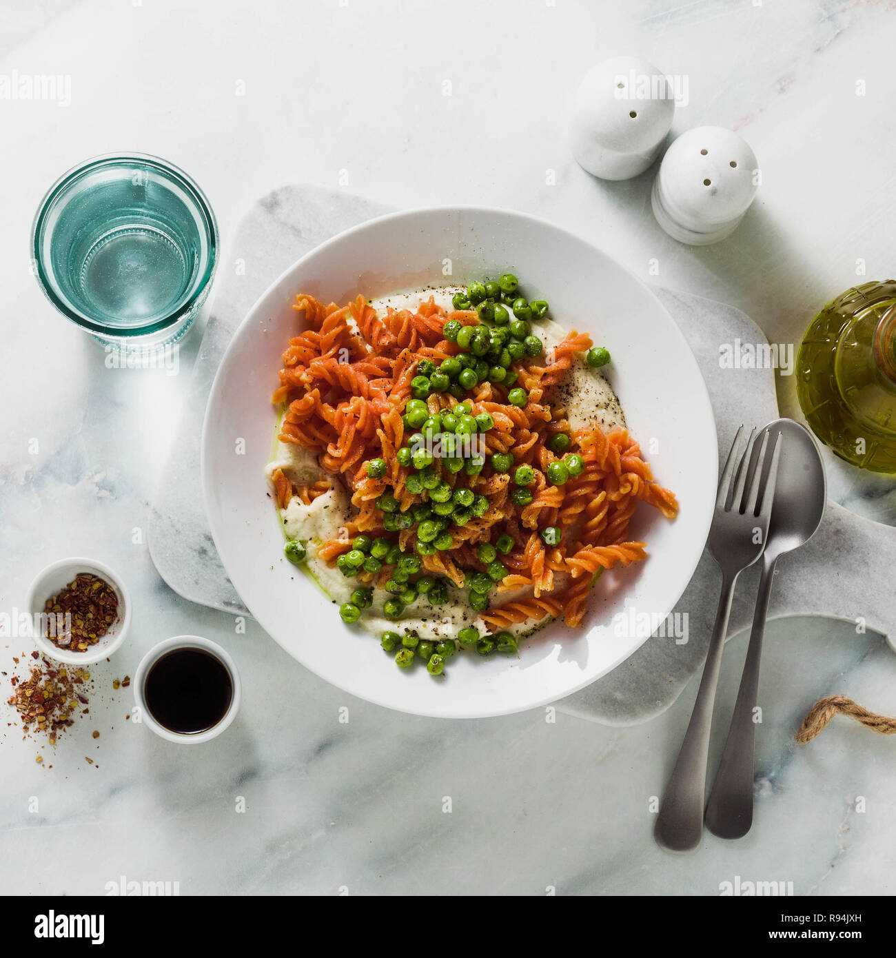 gluten-free healthy vegan red lentil pasta with green peas and ...