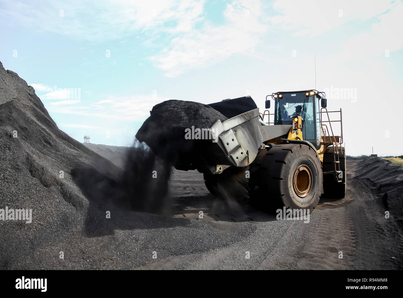 Mining front end loader transporting Manganese ore for processing and ...