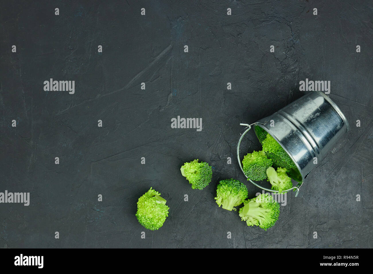 placer green broccoli segments from a small bucket. Healthy eating ...