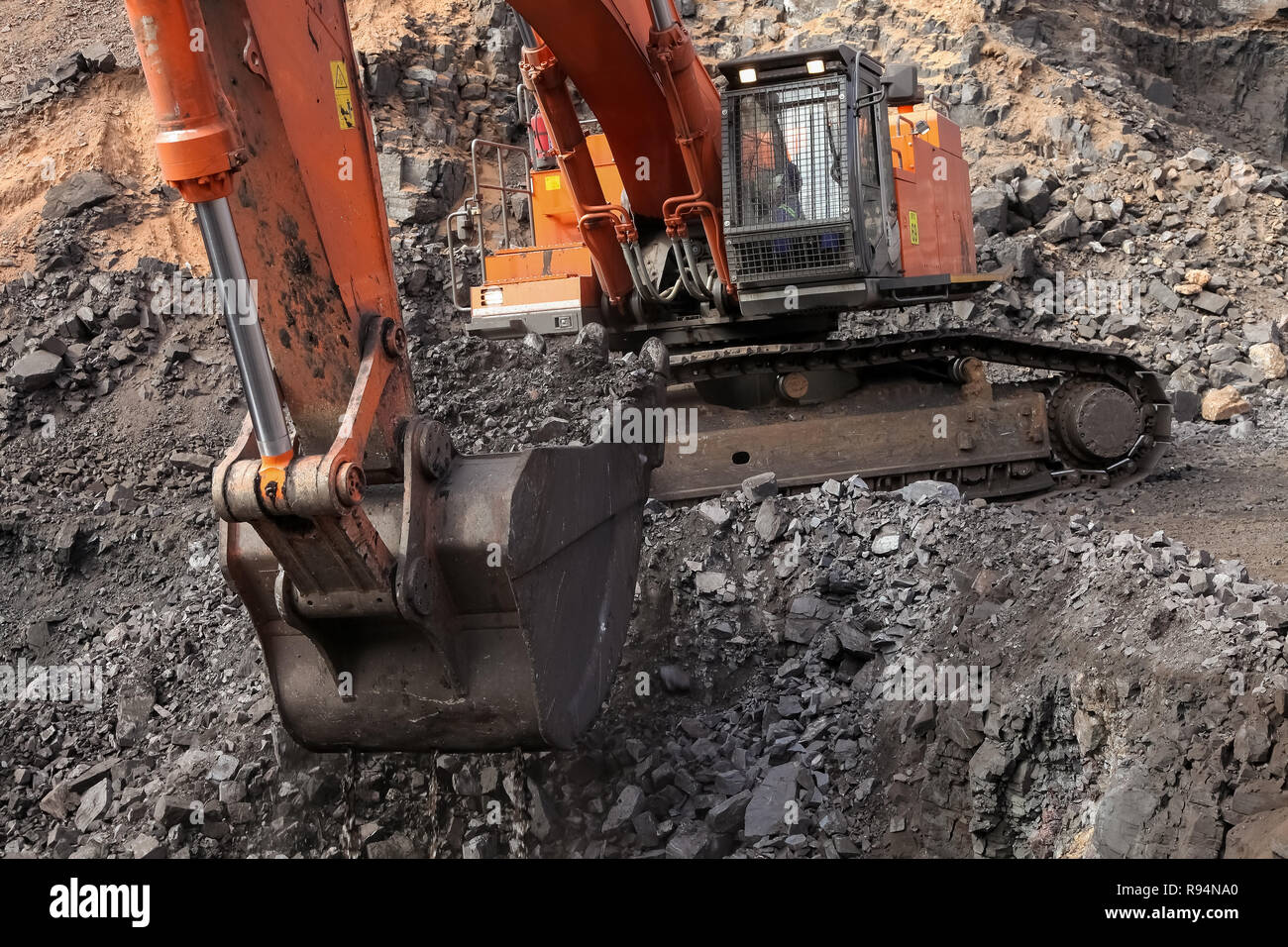 Open pit Manganese Mining - Excavator digging out ore rich rock and ...