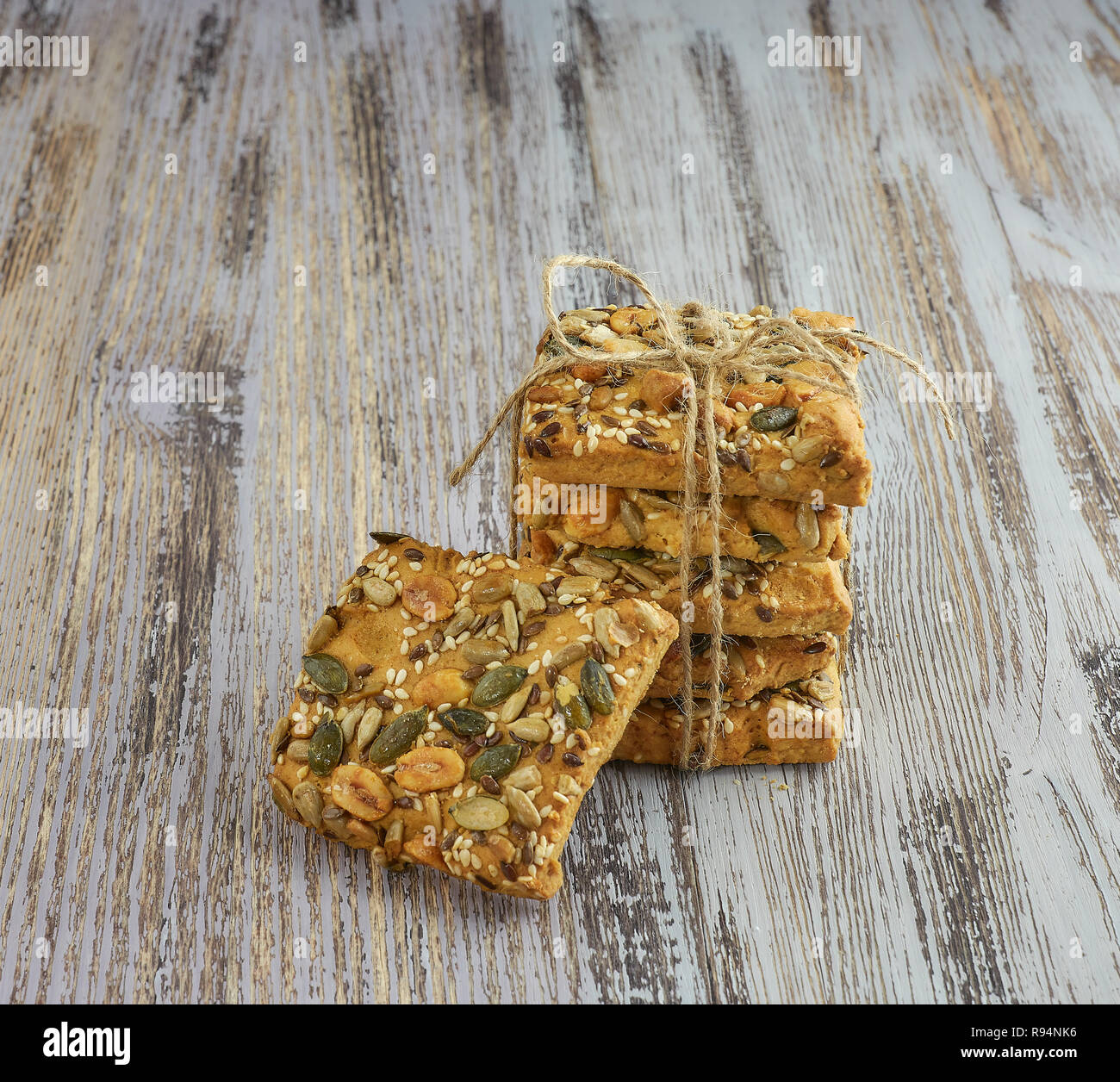 A stack of shortbread cookies with different types of nuts to a ...