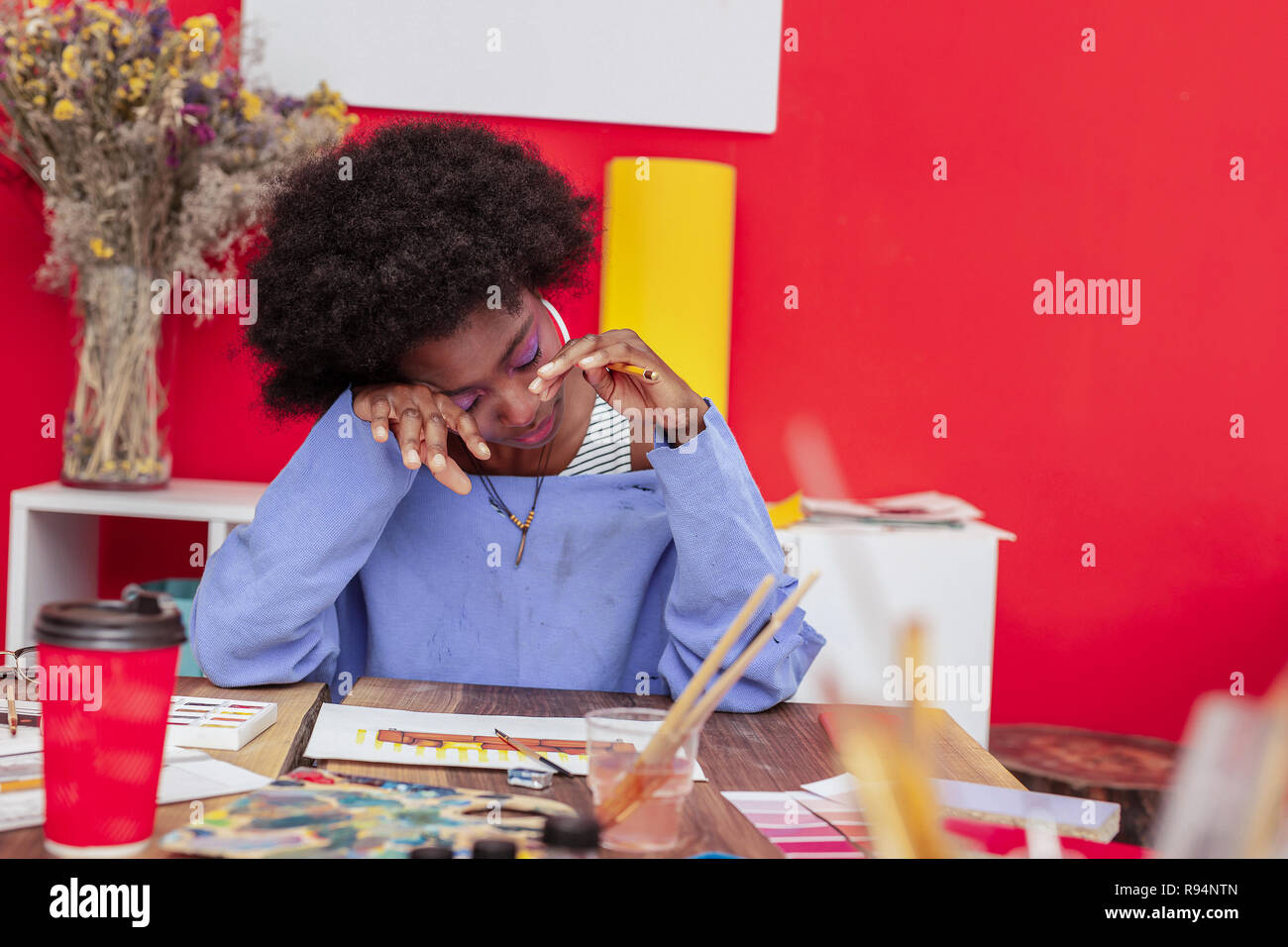 Tired exhausted interior designer falling asleep at work Stock Photo ...