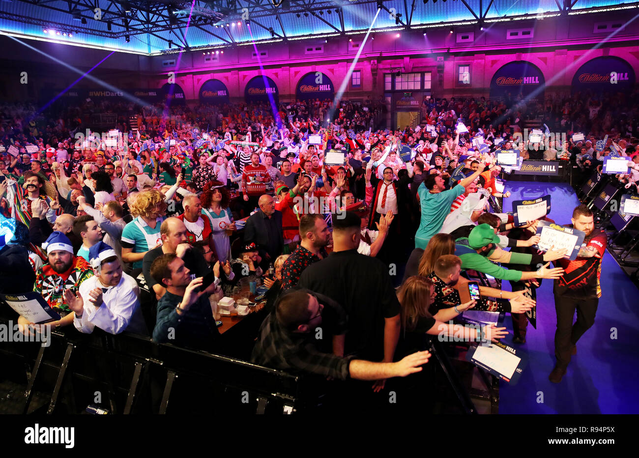 Michael Smith (right) walk out during day seven of the William Hill ...