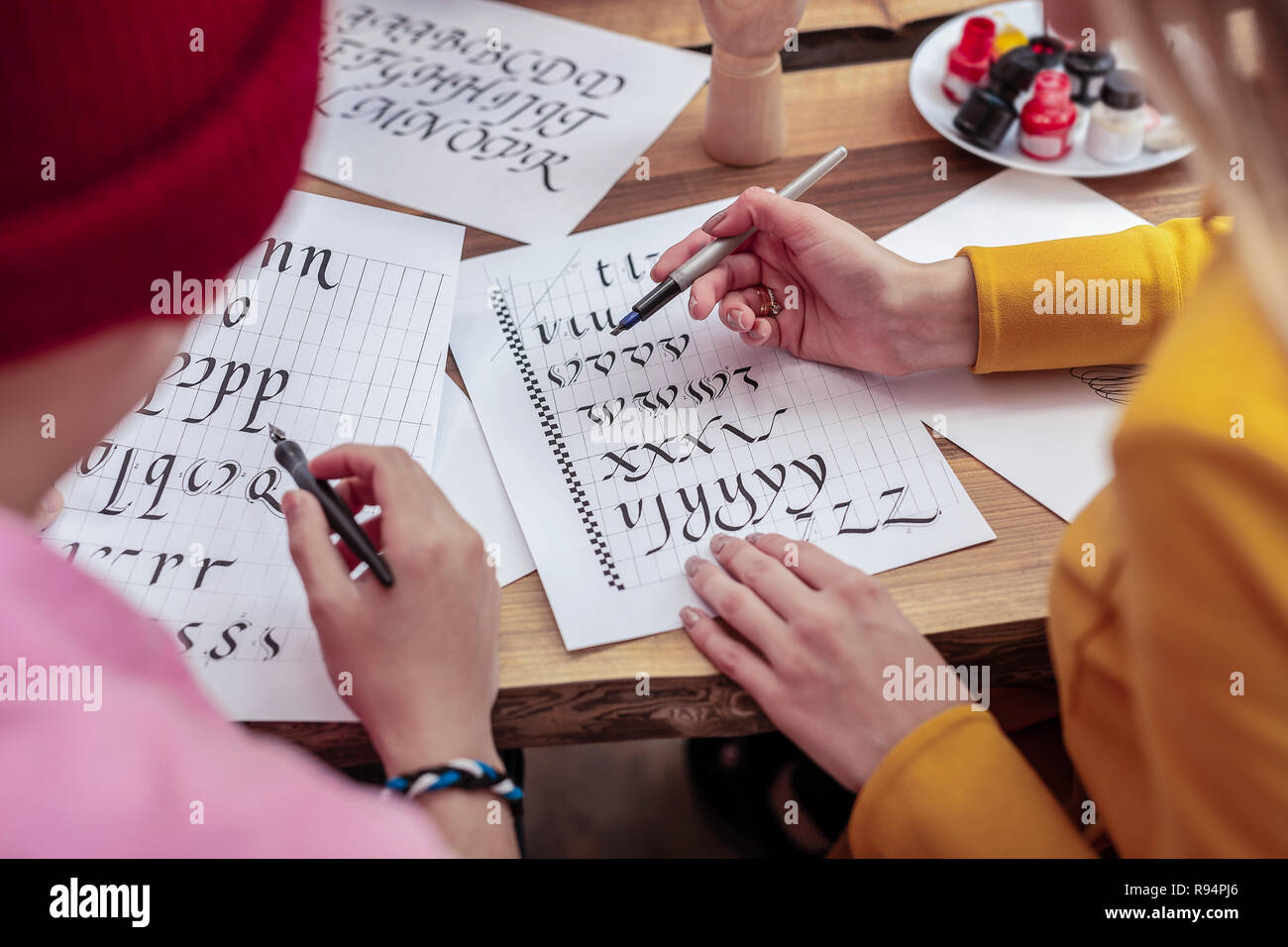Top view of student of art school painting letters together Stock Photo ...