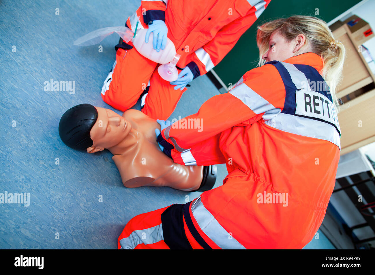 German paramedic trains emergency basics on a puppet Stock Photo - Alamy