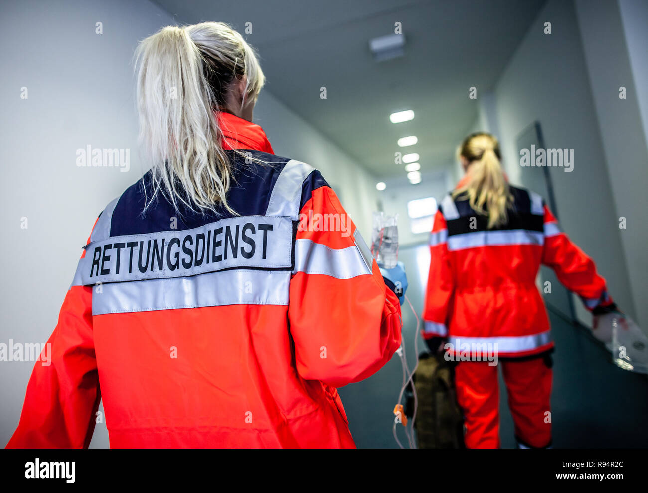 German paramedic runs in a floor to an accident. The german word ...
