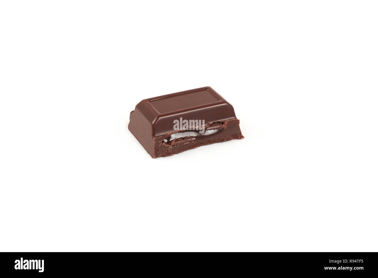 Close-up pieces of chocolate bar with filling isolated on white ...