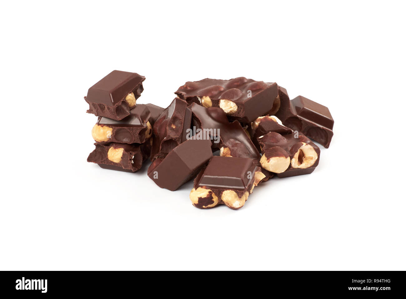 Chocolate pieces with nuts isolated on white background Stock Photo - Alamy