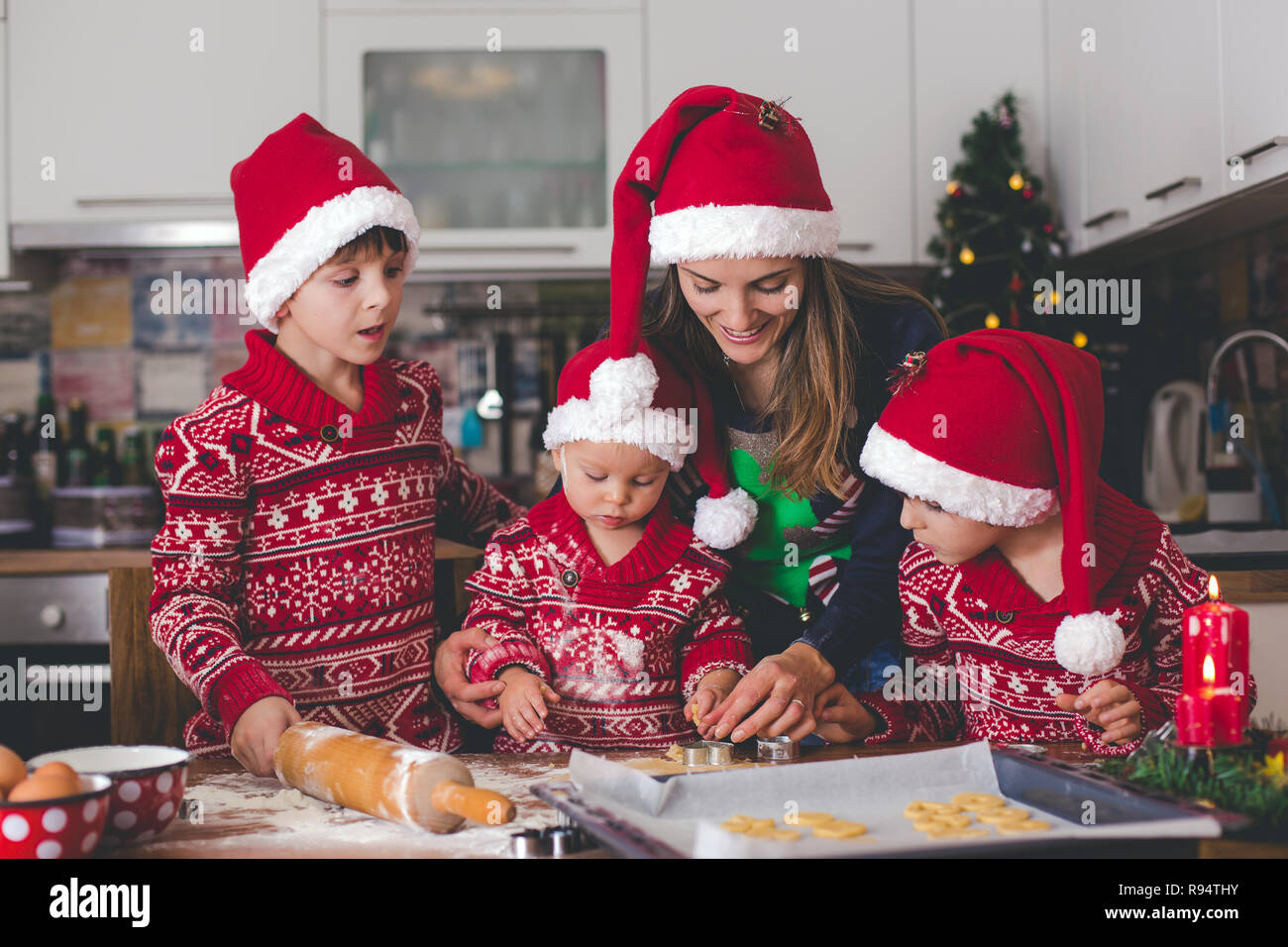 Sweet toddler child and his older brother, boys, helping mommy ...
