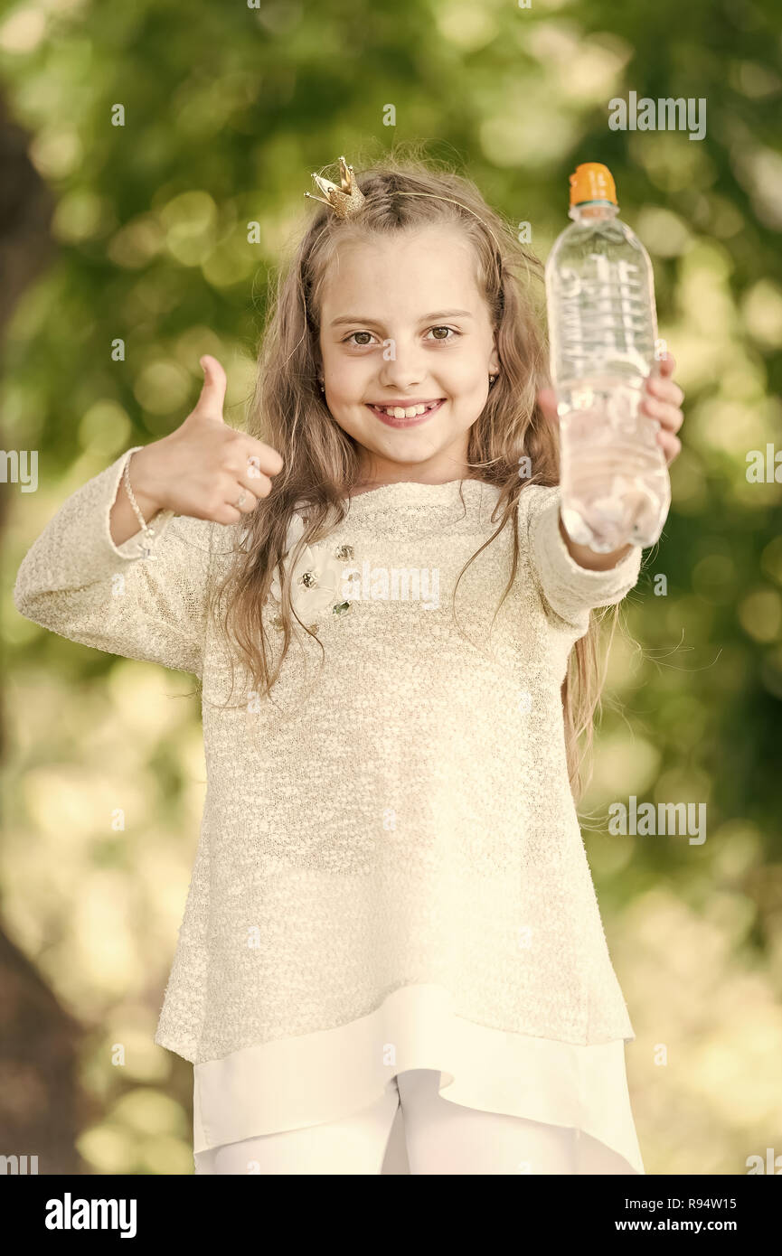 Lovely happy little princess girl with water showing yes gesture on ...