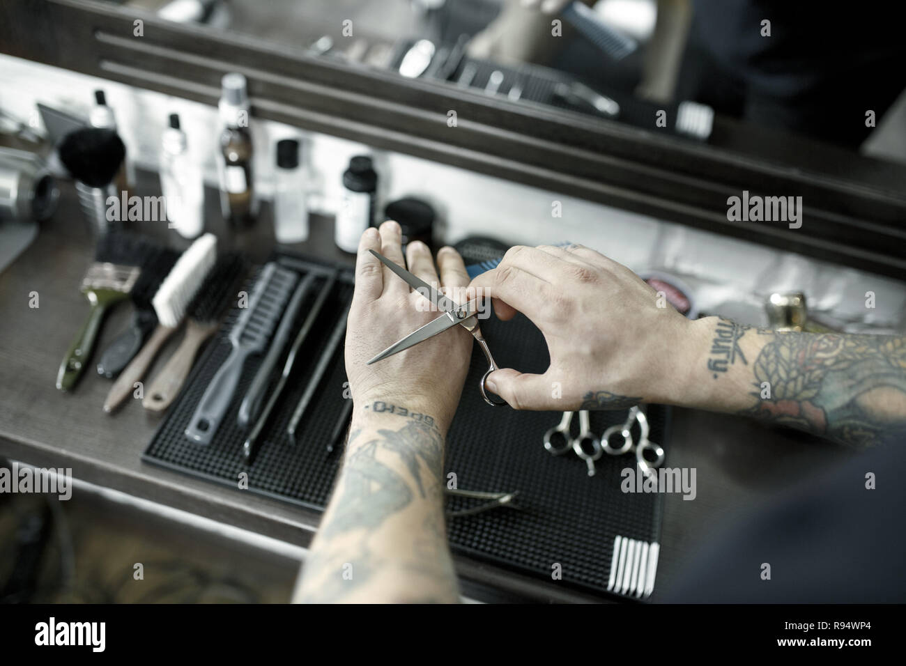 The male hands and tools for cutting beard at barbershop. Vintage tools ...