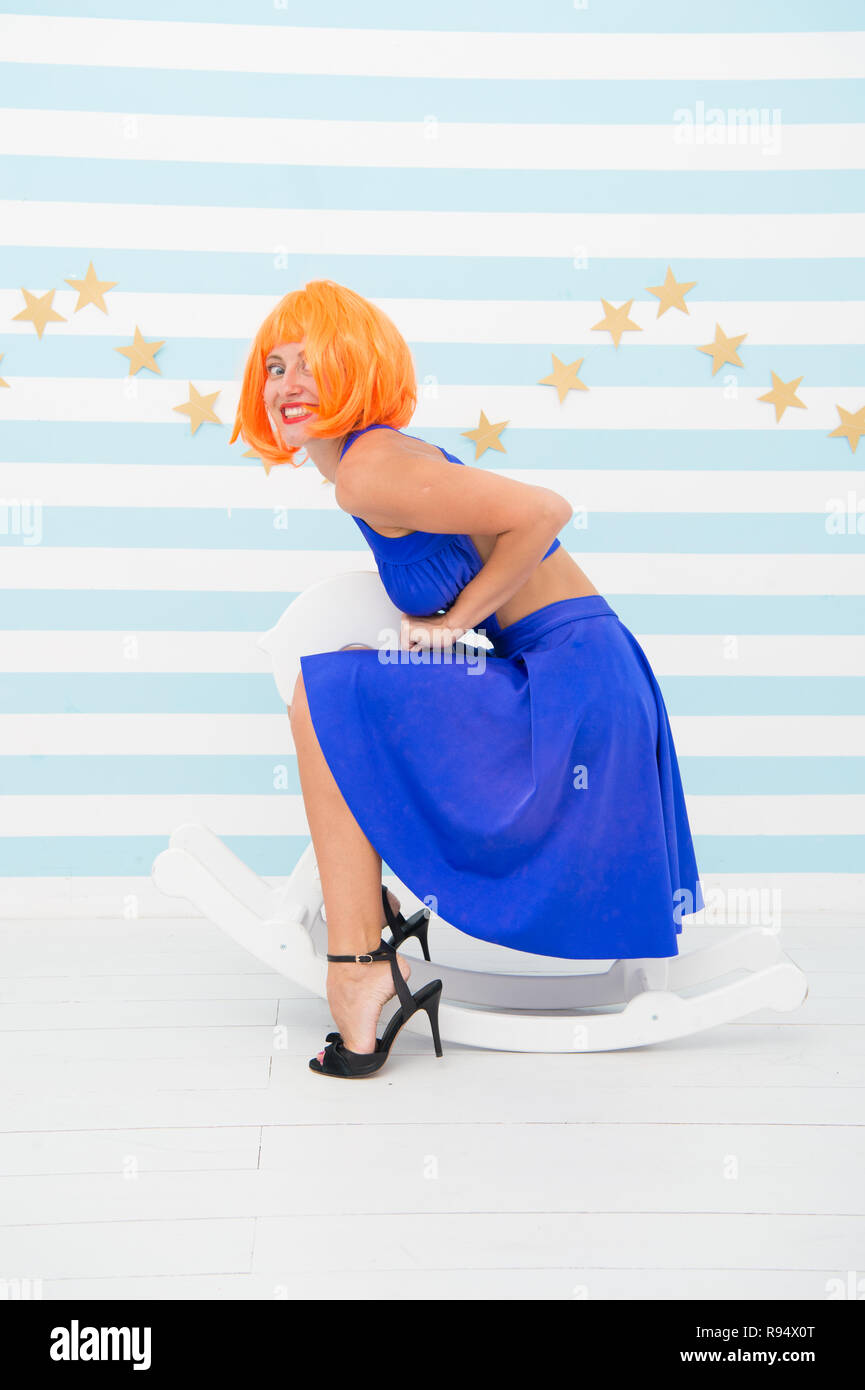 Lady red or ginger wig blue dress rides rocking horse. Comic and ...