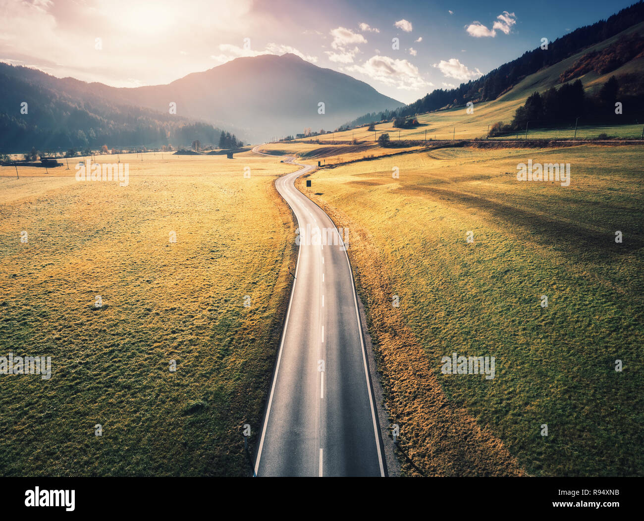 Aerial view of the road in mountain valley in Dolomites, Italy. Top ...