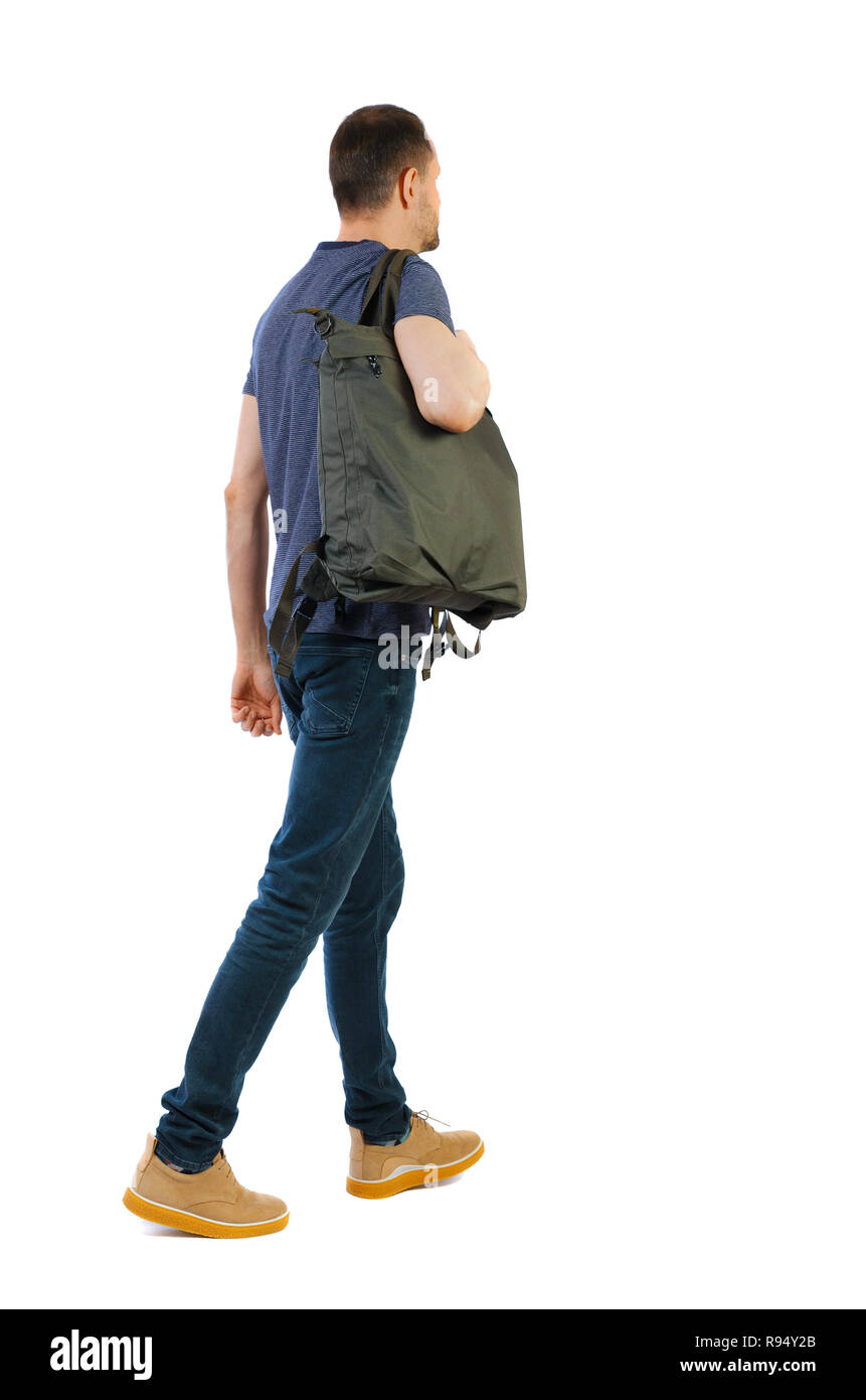 back view of walking man with green bag. backside view of person. Rear ...