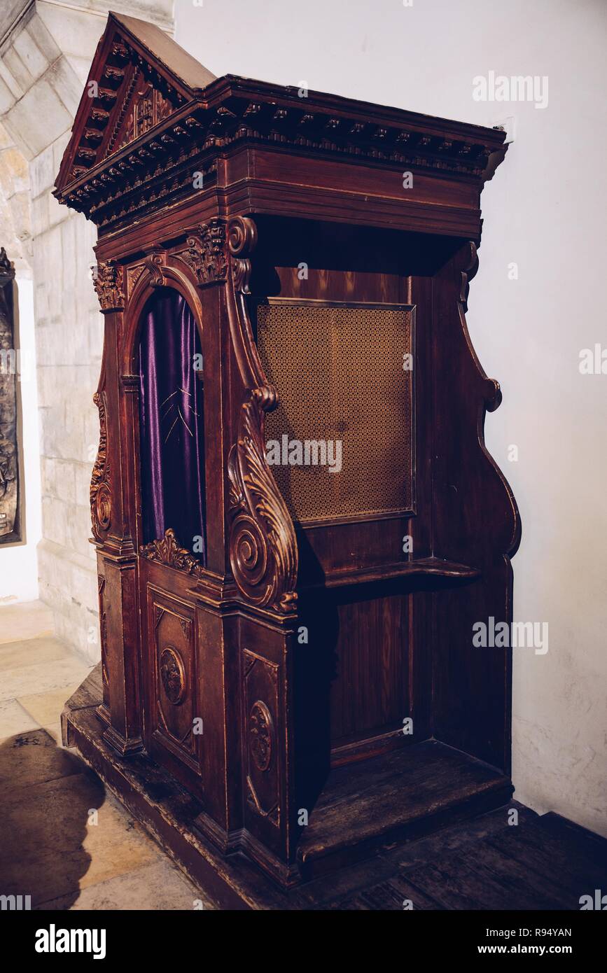 Old brown wooden confessional in the catholic church Stock Photo - Alamy