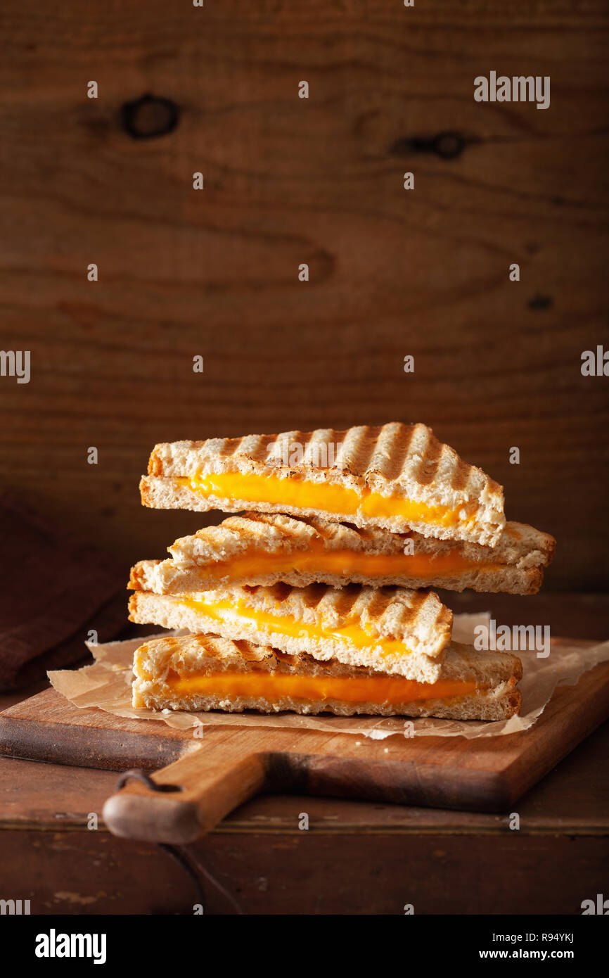 grilled cheese sandwich on rustic brown background Stock Photo - Alamy