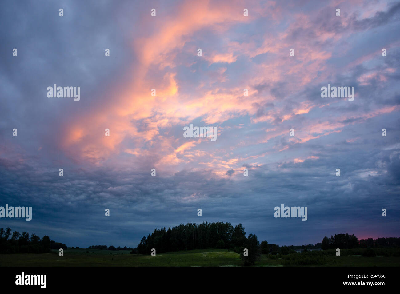 high contrast clouds on blue sky over natural landscape in summer at ...