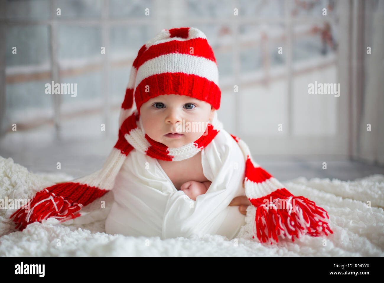 Christmas portrait of cute little newborn baby boy, wearing santa hat ...