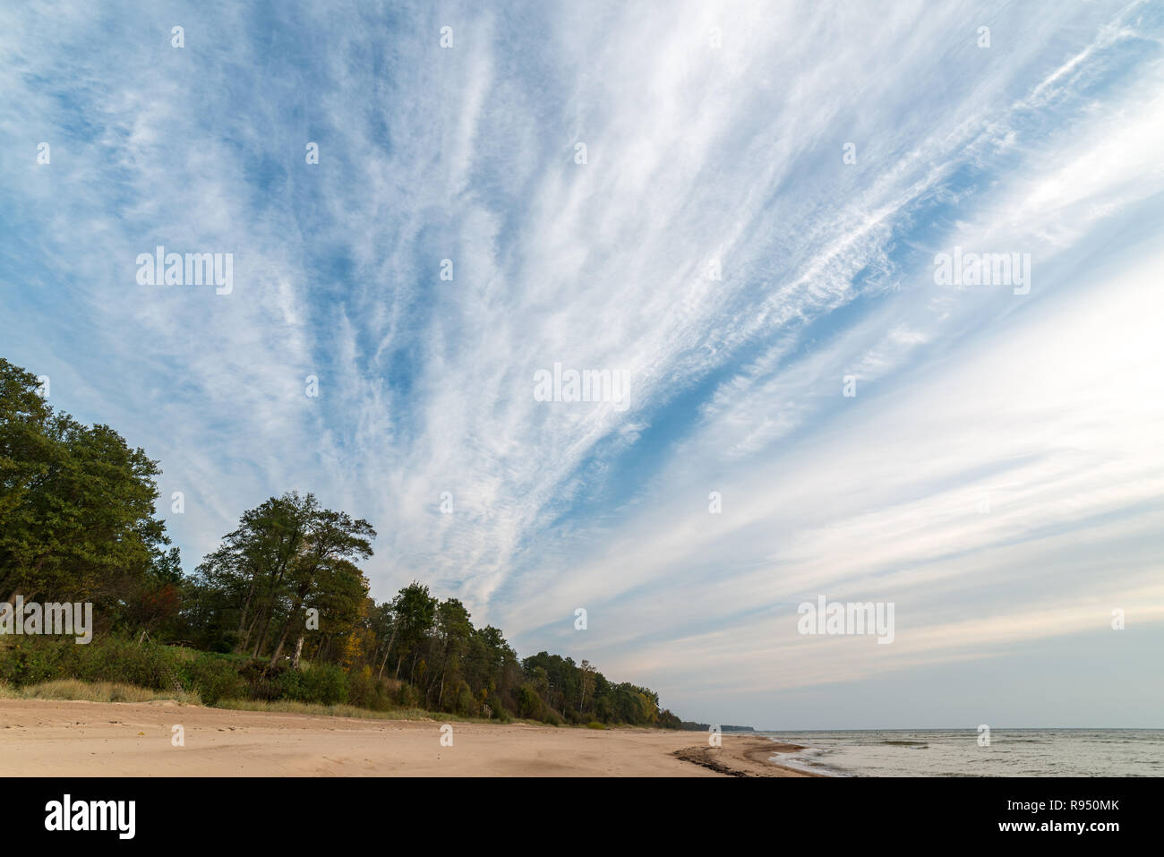 high contrast clouds on blue sky over natural landscape in summer at ...