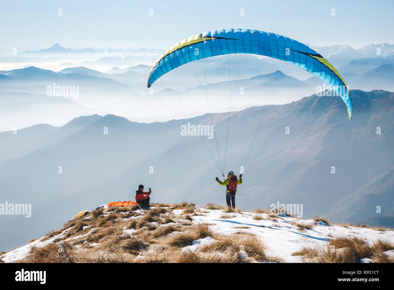 paraglider takeoff on the mountain. Italian Alps Stock Photo - Alamy