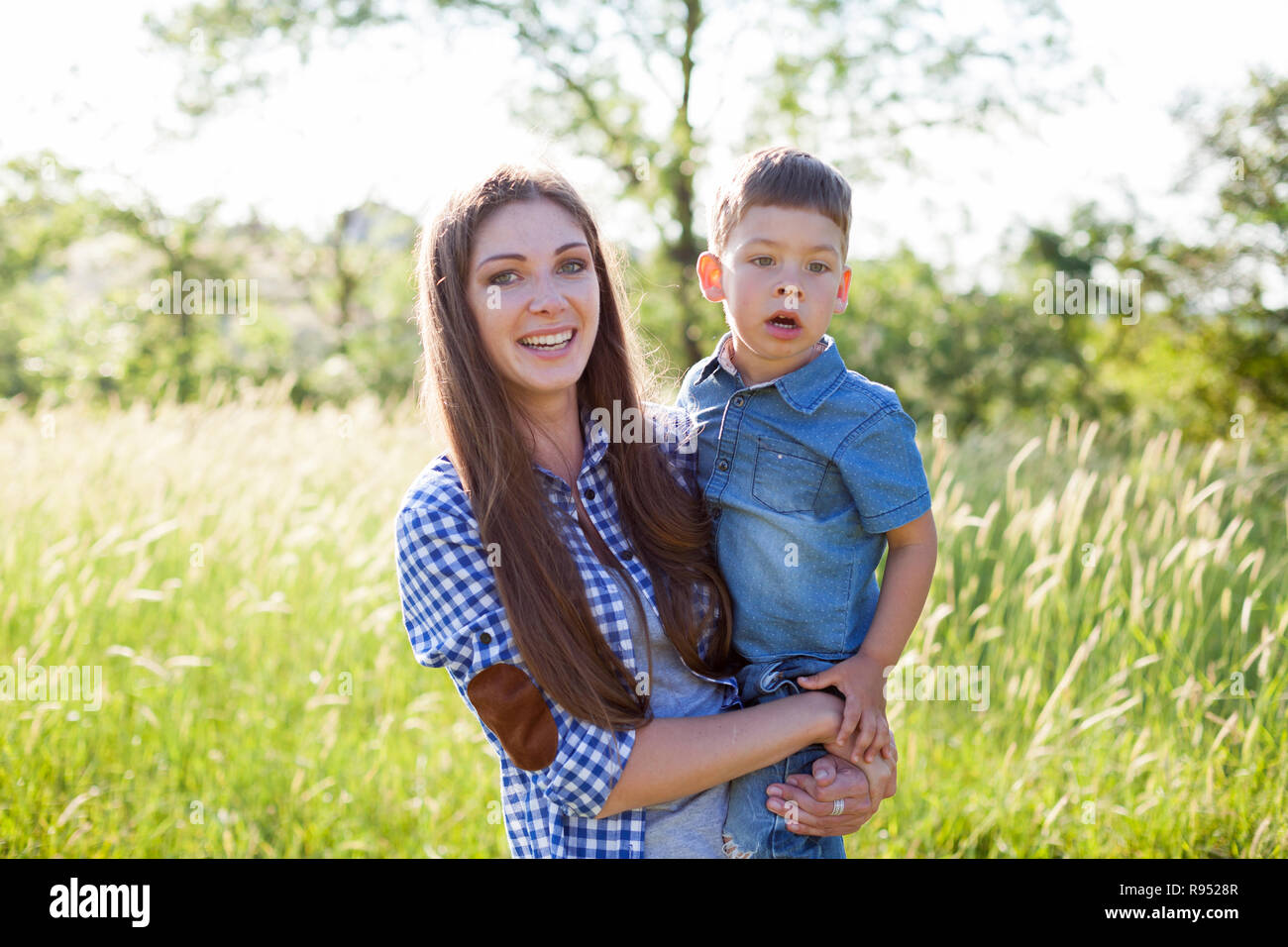 beautiful woman and small boy portrait nice Stock Photo - Alamy