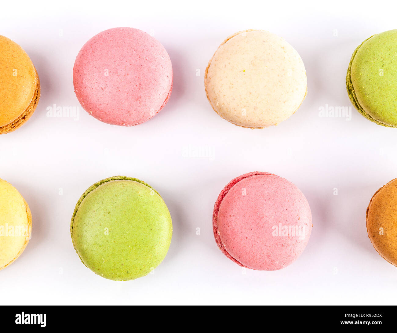 Top view of two rows of French macarons isolated on white - closeup ...