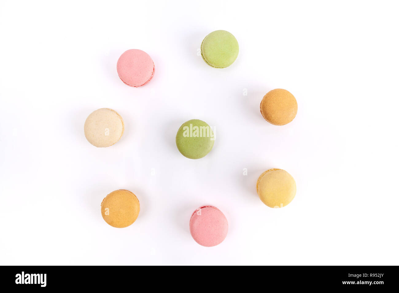 Colorful macarons arranged in a circle isolated on white background ...