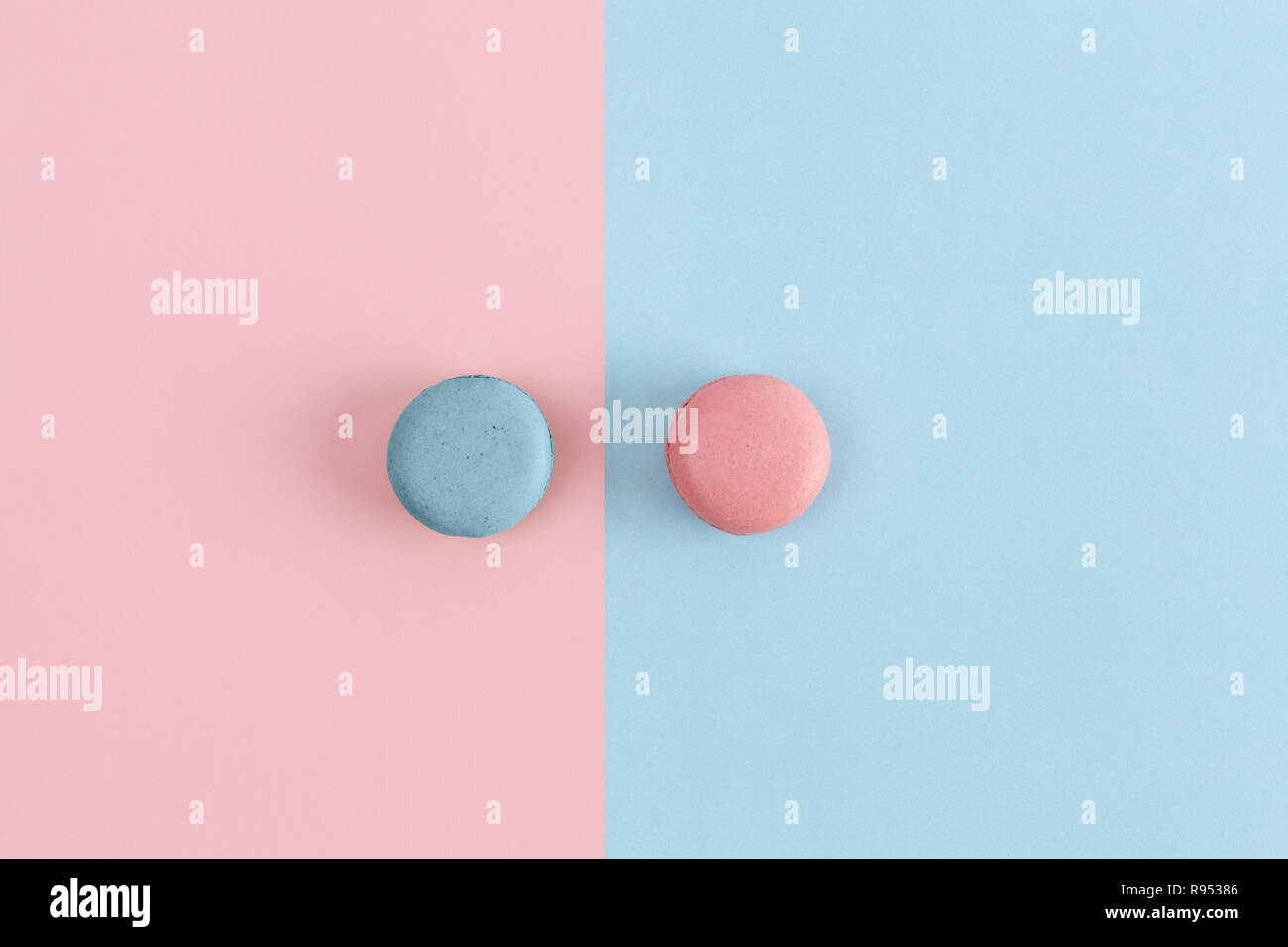 Pink and blue macarons on divided background. Clean design top view ...