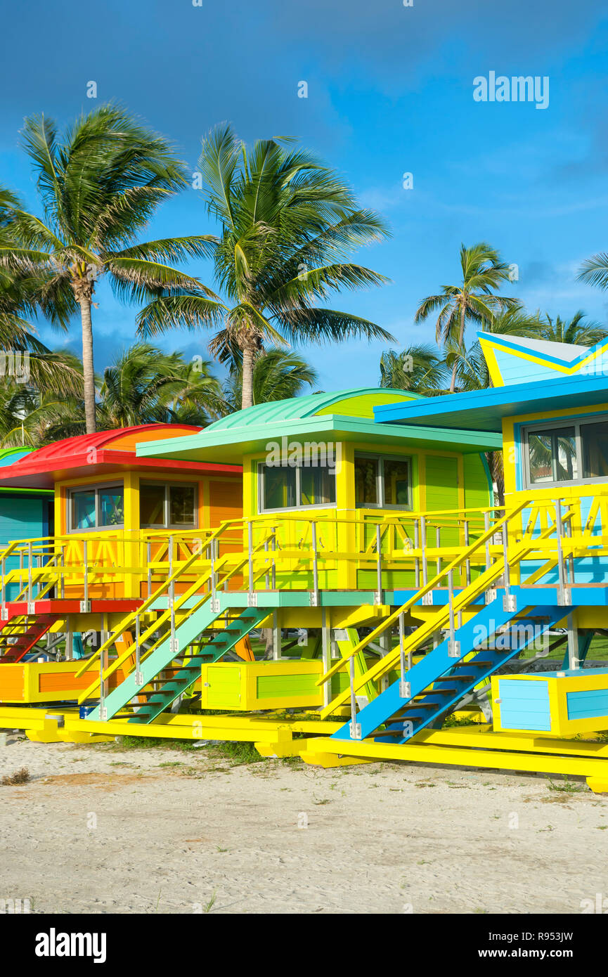 Colorful scenic morning view of brightly painted lifeguard towers with ...