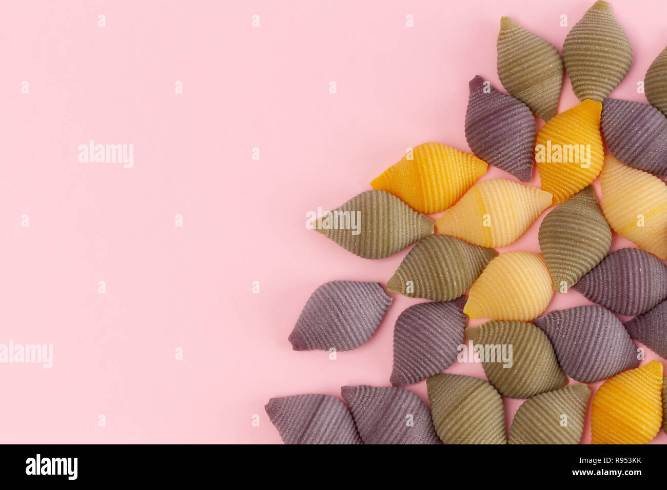 Conchiglie Rigate pasta shells on pink background with copy space Stock ...