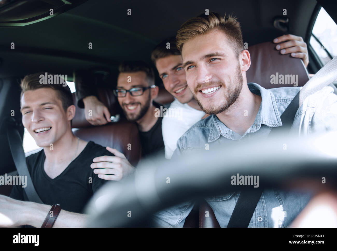 Group of happy friends on a car Stock Photo - Alamy