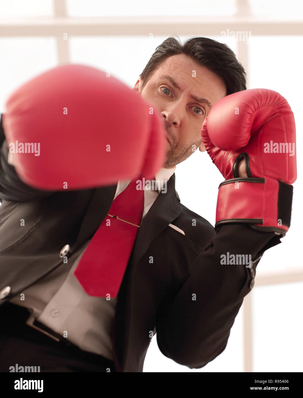 close up.a serious businessman in red Boxing gloves Stock Photo - Alamy