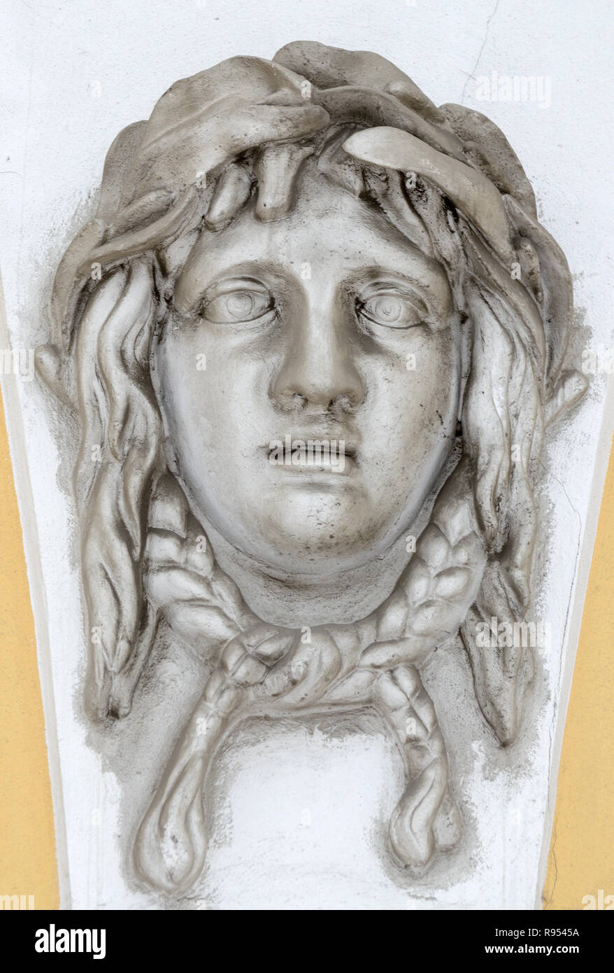 The face of a woman from the ancient era of Greece .On his neck tied a ...