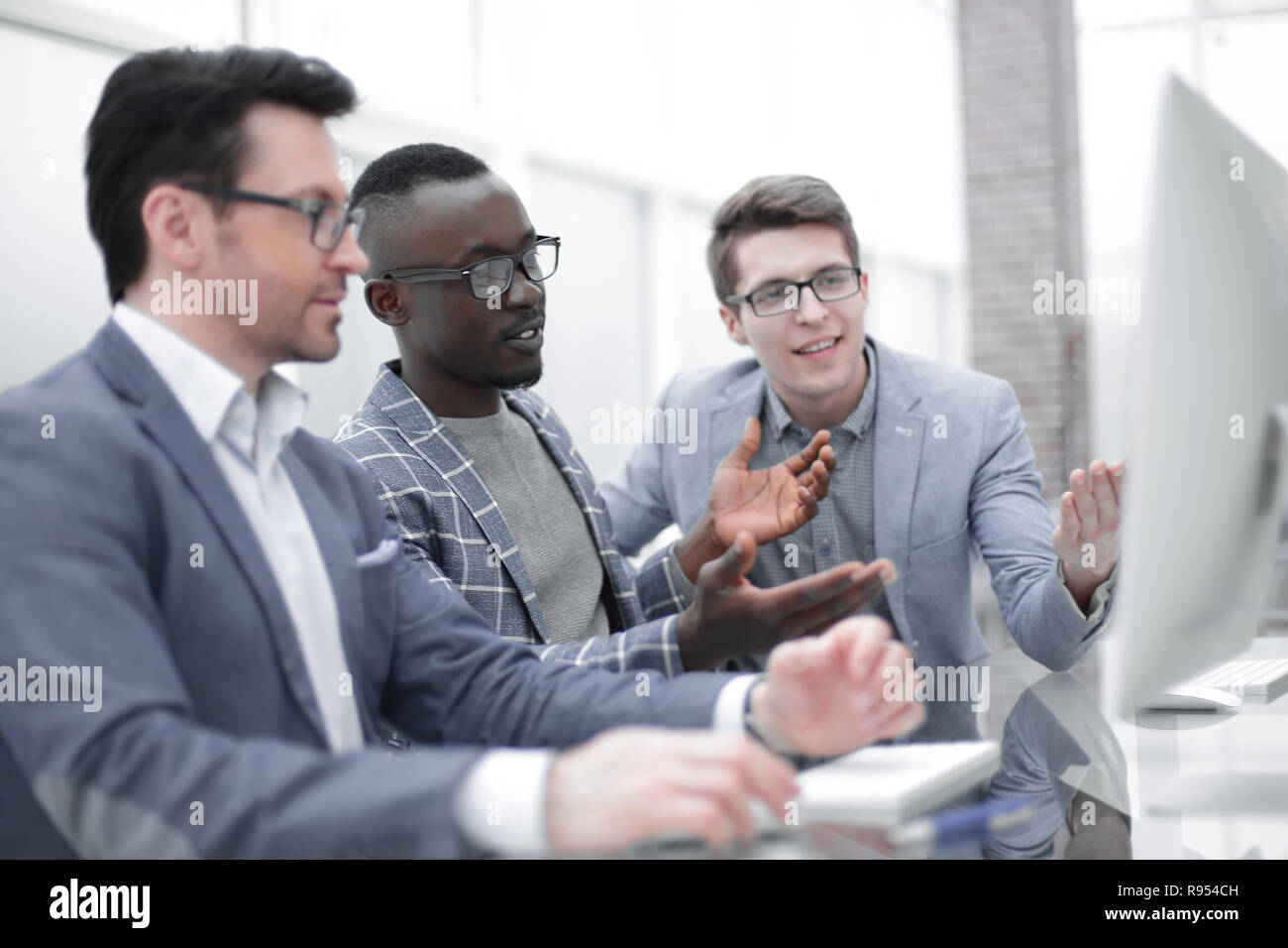 employees using a computer to analyze data Stock Photo - Alamy