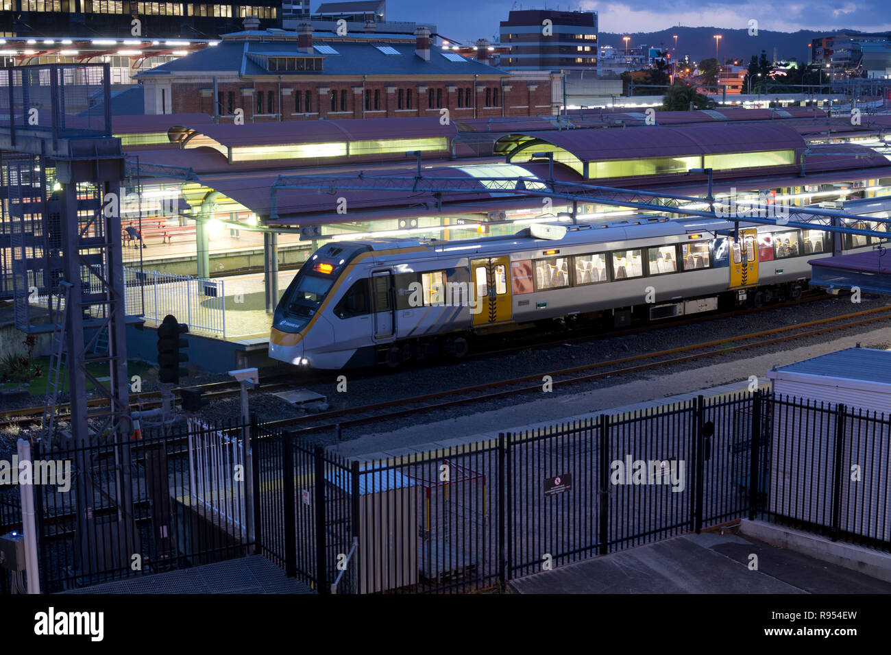 Queensland Rail train at dusk at Roma Street station, Brisbane ...