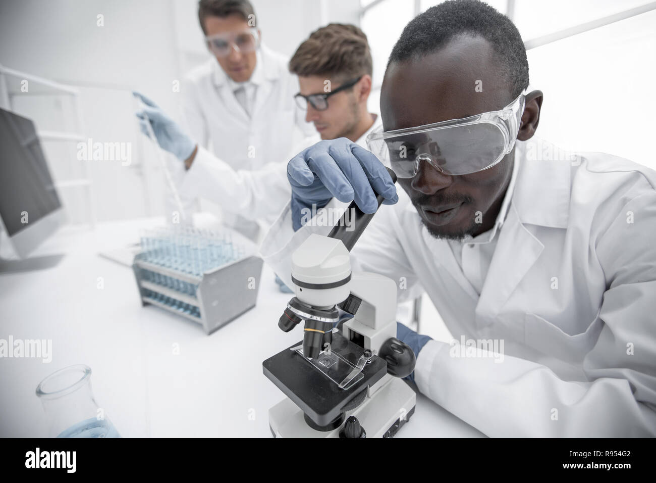 modern scientist uses a microscope in a laboratory Stock Photo - Alamy