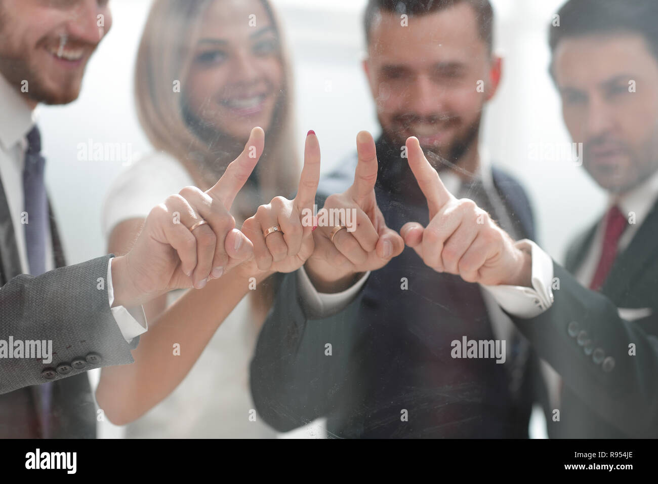 business team pointing to a virtual point Stock Photo - Alamy