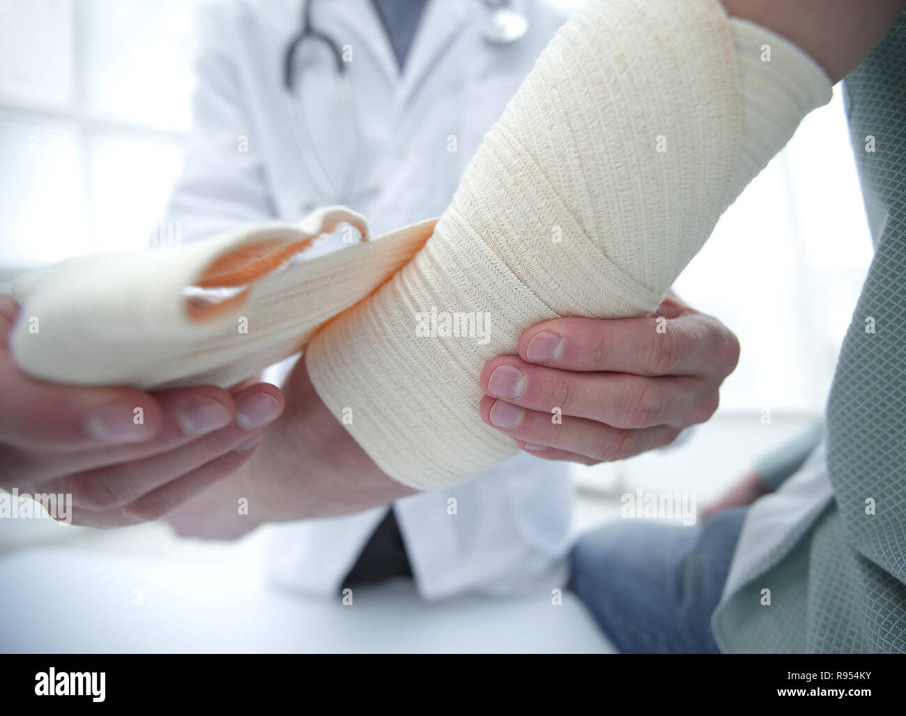 Doctor applying bandage patients hand wrist hi-res stock photography ...