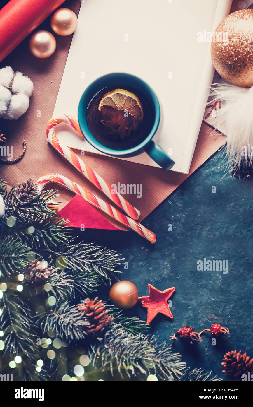 Christmas fir tree, decorations and hot tea with lemon. A letter to ...