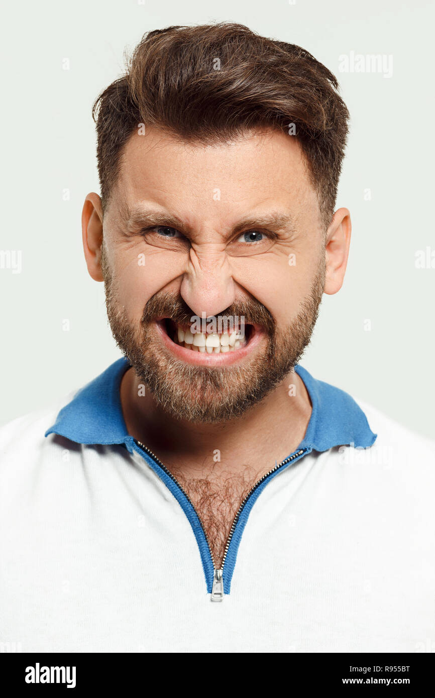 Screaming, hate, rage. Crying emotional angry man screaming on studio ...