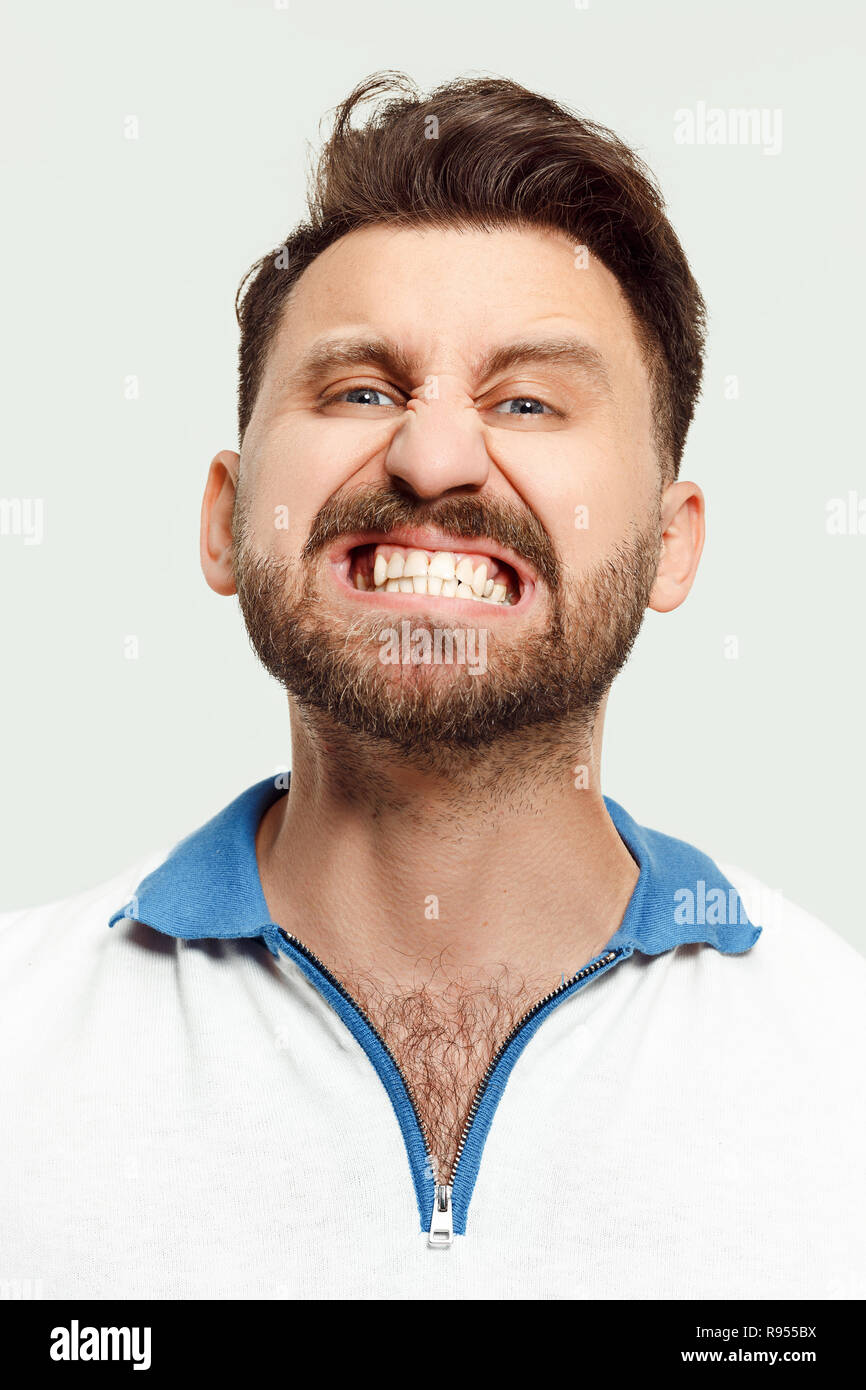 Screaming, hate, rage. Crying emotional angry man screaming on studio ...